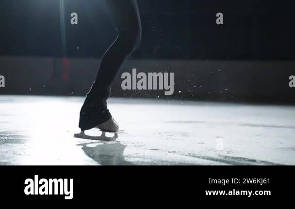 young female champion in figure skating is training on rink, performing ...