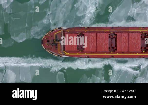 Drone top down Epic red steel icebreaker ship tanker breaks winter ...