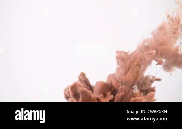 Light brown ink mixing in water after injected into water tank from ...