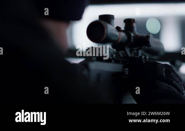 Sniper preparing to shoot with automatic rifle. Male soldier loading ...