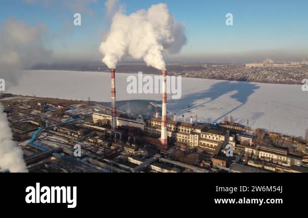 Industrial factory pipes emission carbon gases in atmosphere. Industry ...