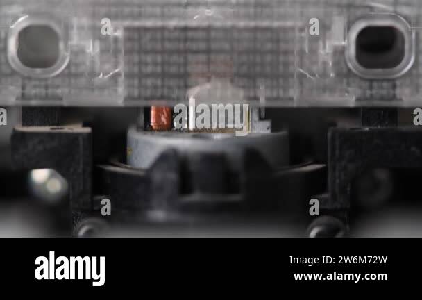 Tape recorder head and roller assembly. Close-up of a reel for a drum ...