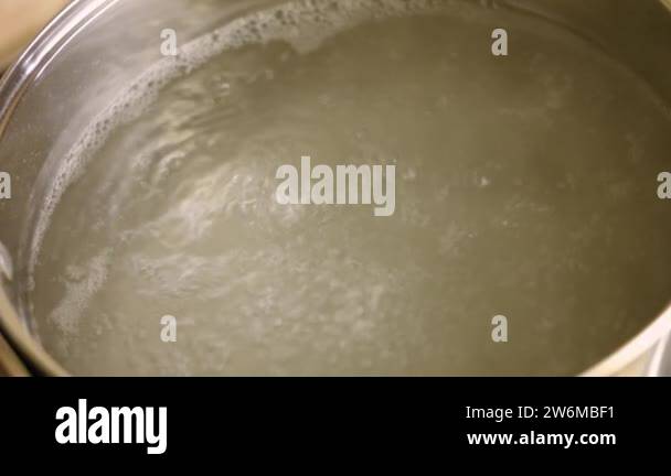 Boiling water in a pot. Process of cooking perfect oven roasted ...