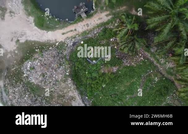 Garbage dump at river and river bank. Environmental pollution and ...
