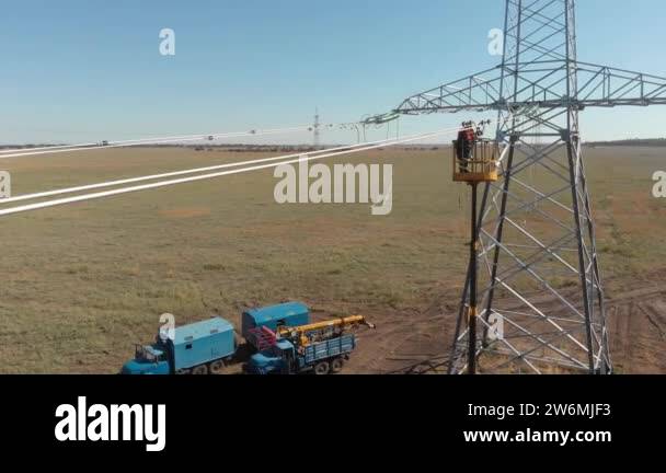 restoration of damage on high-voltage power lines Stock Video Footage ...