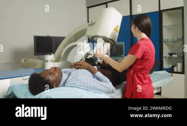 Lithotripsy for kidney and ureteral stones. Back view of woman doctor ...