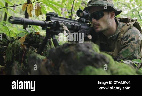 Fully equipped rifle soldier wearing camouflage uniform attacking enemy ...