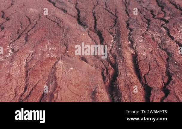 Clay landslide with cracks from erosion - The texture of red clay in ...