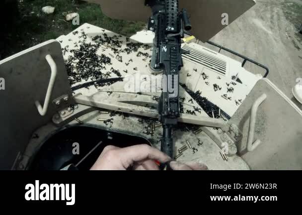 Soldier exits humvee with gun in hand Stock Video Footage - Alamy