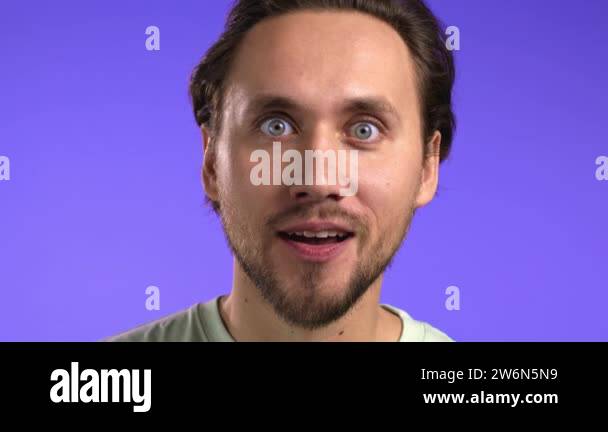 Man depicts amazement, shows delight face effect. Surprised excited ...