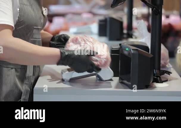 Cashier scanning goods at the supermarket checkout close up. Scanning ...