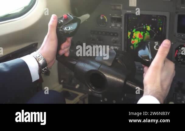 pilot in the cockpit rotating the control wheel yoke of an old private ...