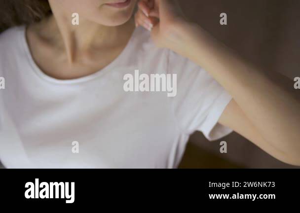 Woman suffering from itching on her skin and scratching an itchy place ...