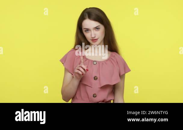 Be careful, caution! Beautiful positive girl with brown hair in dress ...