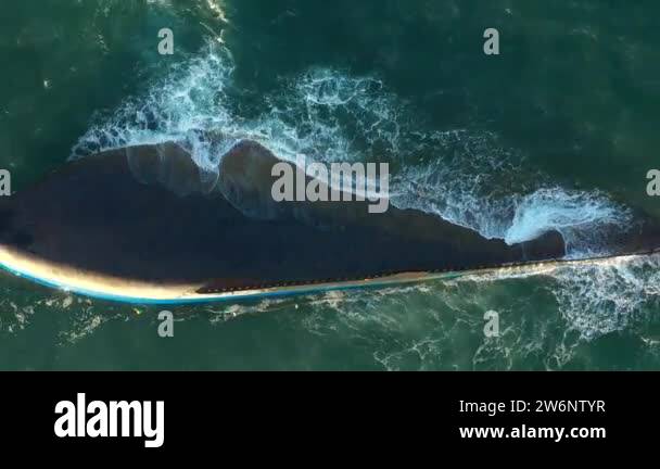 ship sunk at sea. The drone flies from the bottom up over an inverted ...