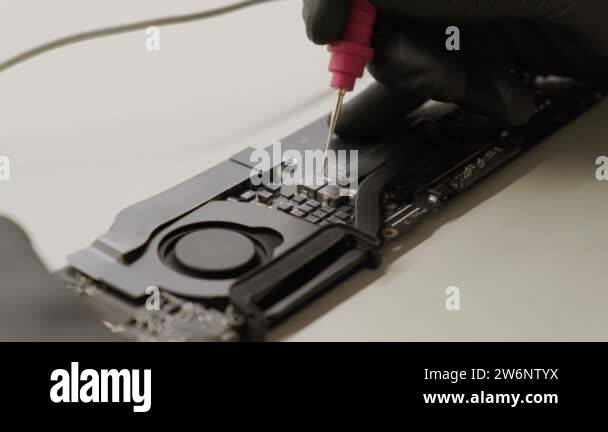 Close up. Electronic renovation in repair shop, testing electric ...