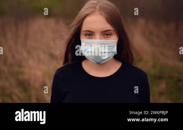 woman make facepalm. a girl in a medical mask hit forehead hand Stock ...