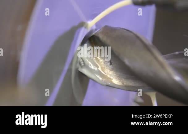 Drilling a metal workpiece using a lathe. The operation of lathe ...