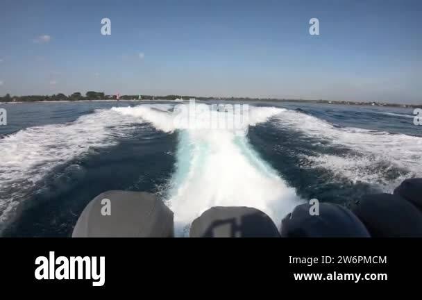 Picturesque view of the wake behind a large speedboat at sea. Stock ...