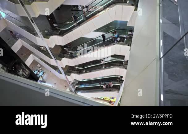 Lots of escalators in the modern multi-level shopping mall center ...