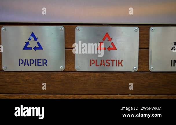 Garbage bin in public place with waste separation signs as sustainable ...