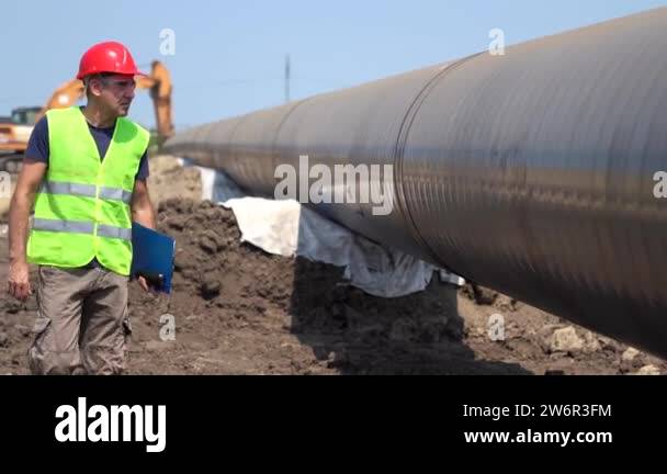 Construction Foreman Checking Petrochemical Gas Pipeline at ...