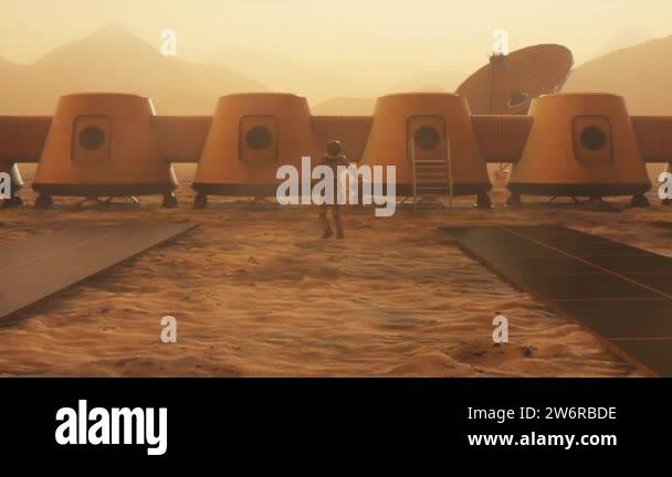 Astronaut on the planet Mars performing a dance at his base. Small dust ...