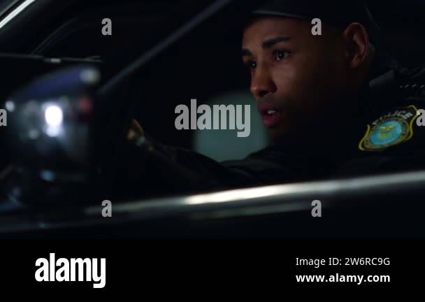 Police man aiming with gun behind car. Police officer screaming with ...