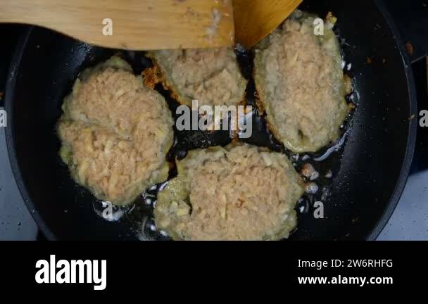 Toasted crispy crust golden potato pancakes or deruny fried in boiling ...