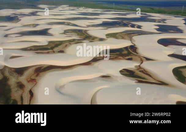 Sand dunes mountains and rain water lagoons at northeast brazilian ...