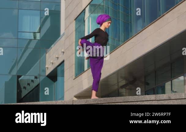 Strong calm woman muslim islamic girl in hijab barefoot lady in purple ...