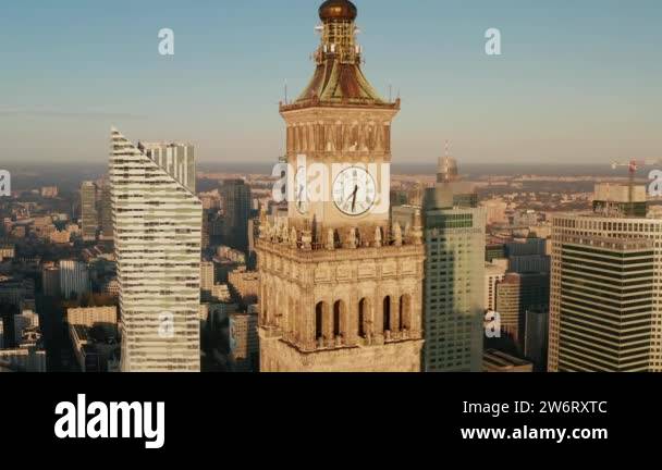 Pull back footage of tower clock on top of high rise historic building ...