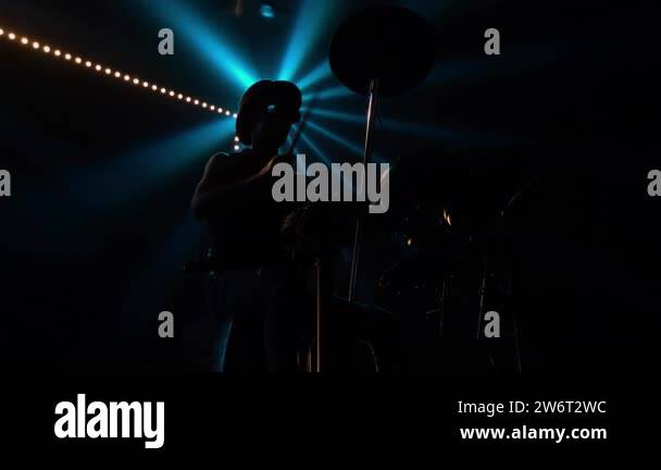 Bottom view of a rock musician playing drums and percussion cymbals ...