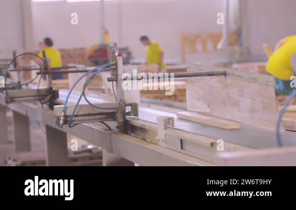 Working process at a furniture factory. People work on the conveyor ...