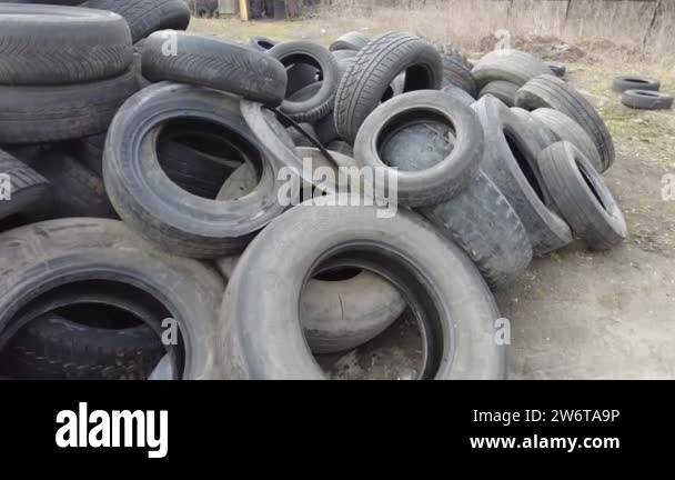 a mountain of old tires. dump of used wheels. Industrial landfill for ...