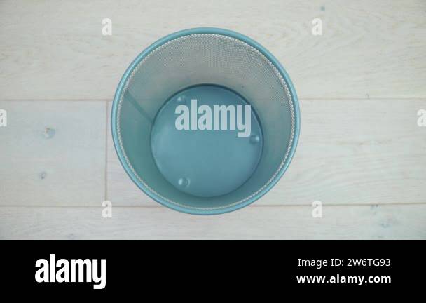 Three items of mens clothing fall into the trash. Sorting and ...