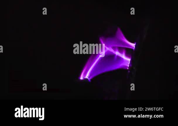 High Voltage Plasma Arc. A bright purple arc created in the ...