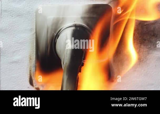 The plug from the electrical appliance inserted into the socket burns ...