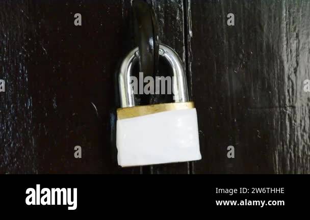 The man unlocks open the master key on the door know with his key ...