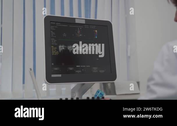 Doctor doing a doppler sonography a male patient in a cardiology clinic ...
