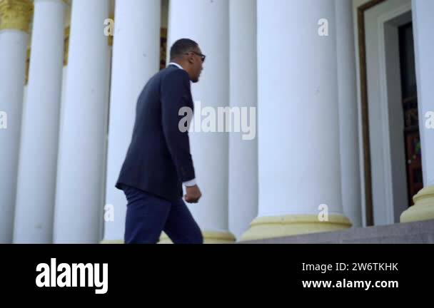 Side view of confident African American businessman in elegant suit ...