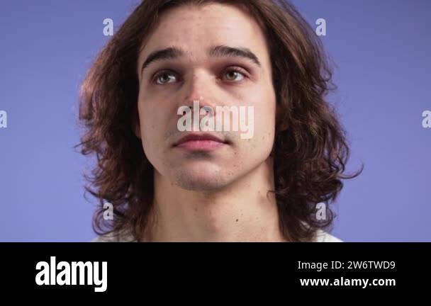 Serious man showing yes sign, nods her head approvingly. Guy with long ...