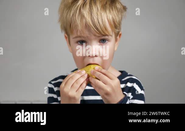 Happy Child Enjoys Eating Tasty Pear. Portrait Cute Little Boy. Glad ...