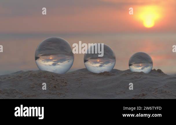 Three clear crystal balls of three sizes are sphere reveals seascape ...