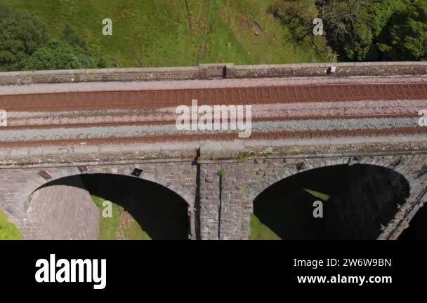 A descending shot looking at the Dent Head Viaduct. The shot gets a ...