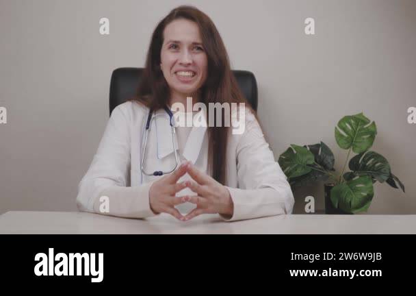 woman doctor laughing office, nurse talking with patient, giving ...
