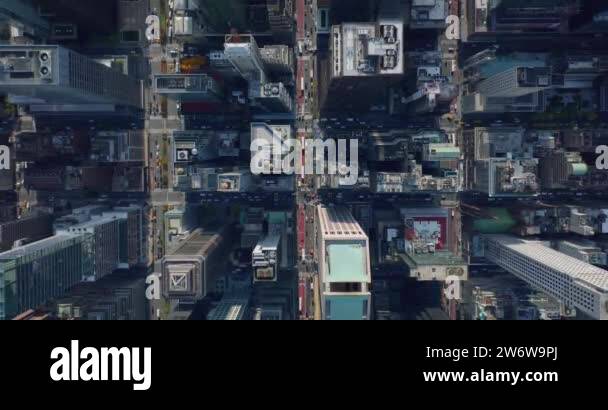Aerial birds eye overhead top down ascending footage of buildings and streets in midtown ...