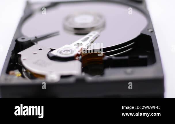 Video of Opened Hard Disk Drive with spinning platter. Close up of a hard disk drive reading and ...