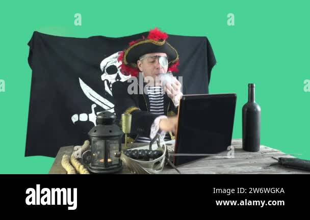 Happy one-eyed pirate hacker in triangular hat smokes pipe and types on ...