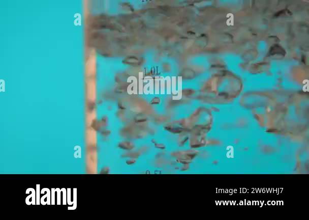 Boiled water in glass electric kettle close up. Hot water bubbles in ...